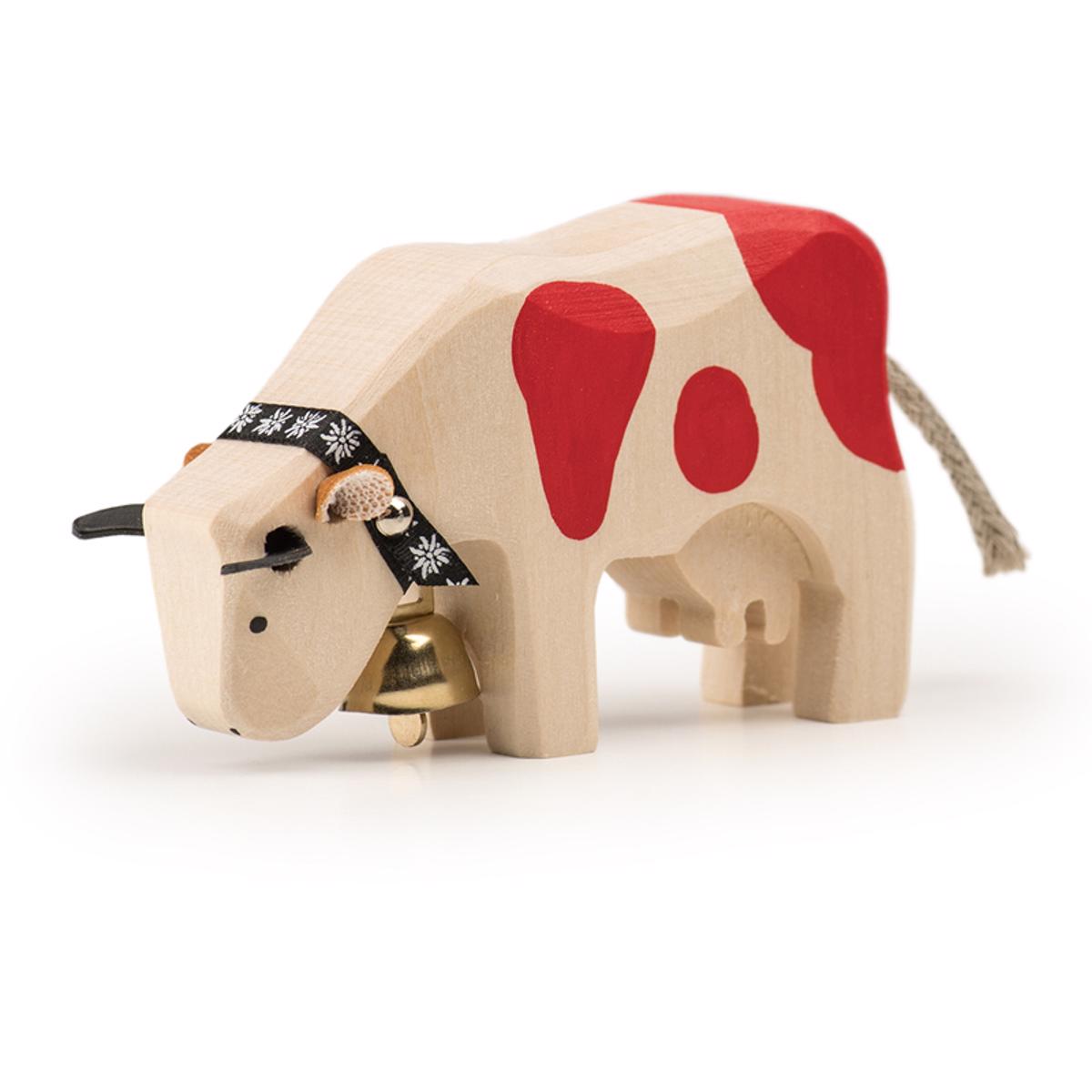 Trauffer Shop - Trauffer Holzspielwaren /Kühe - Cow 1 eating red